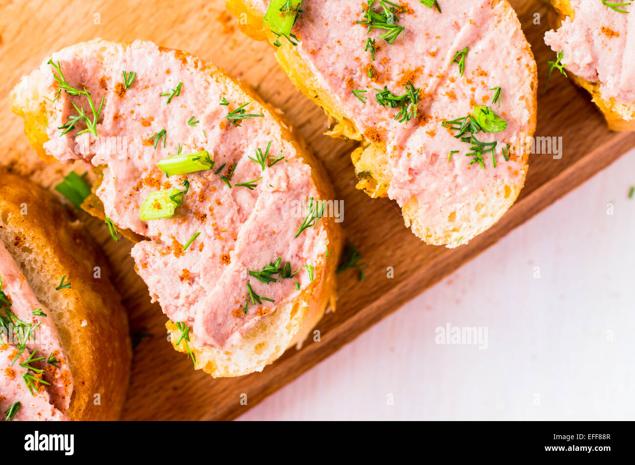 Tapas. Bread with meat paste, herbs and spices Stock Photo - Alamy