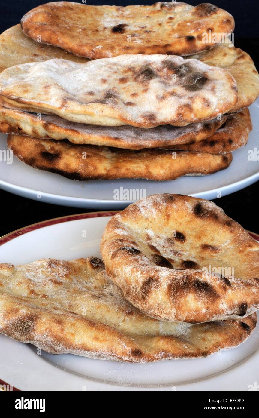 Freshly cooked coriander and garlic Naan bread Stock Photo - Alamy