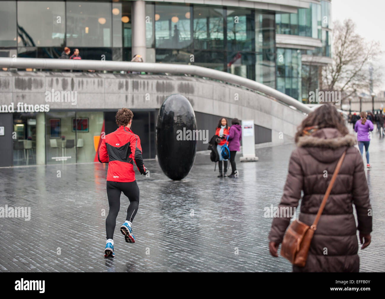 A jogger on the South Bank in London Stock Photo - Alamy
