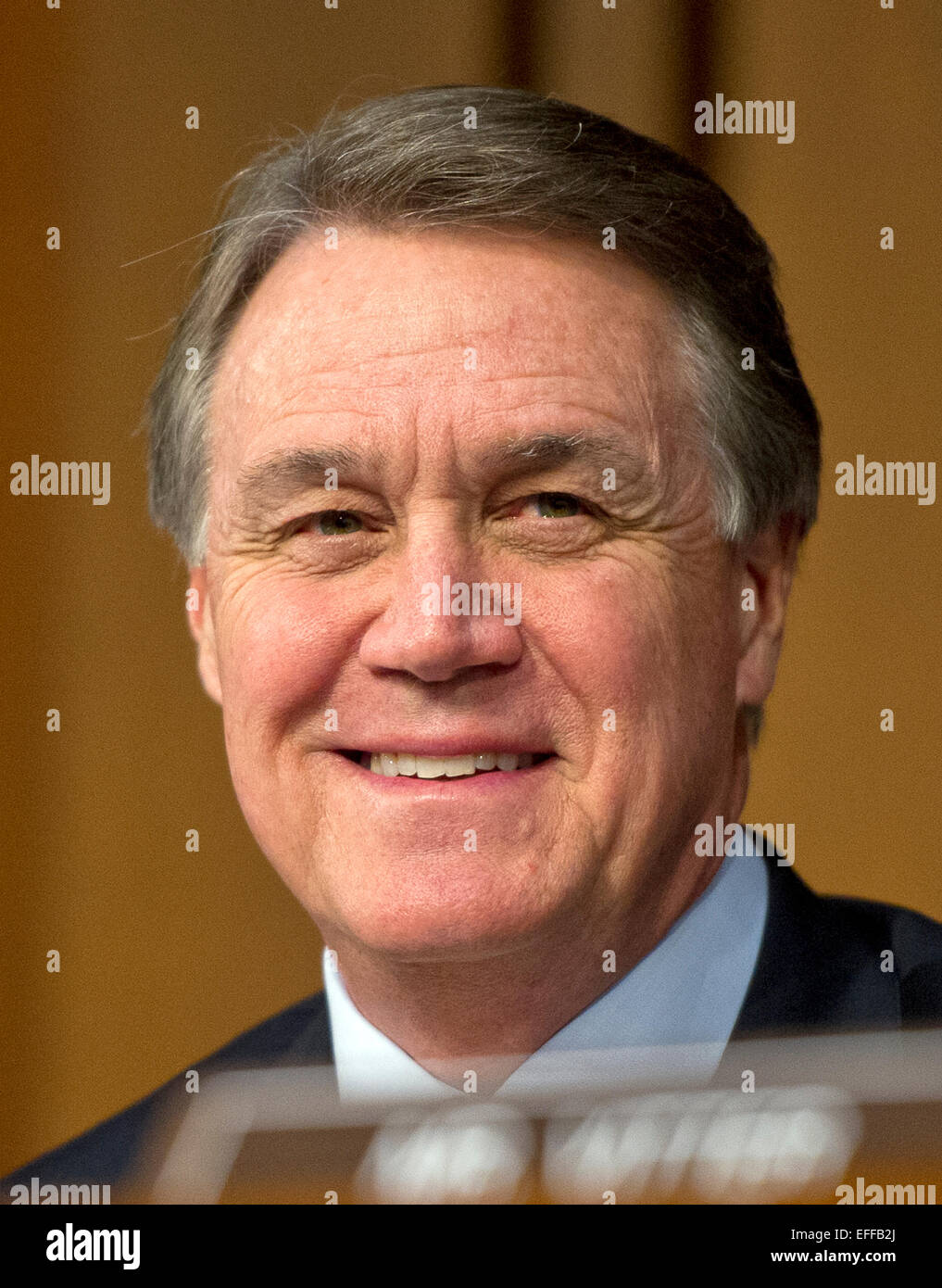United States Senator David Perdue (Republican of Georgia) listens as ...