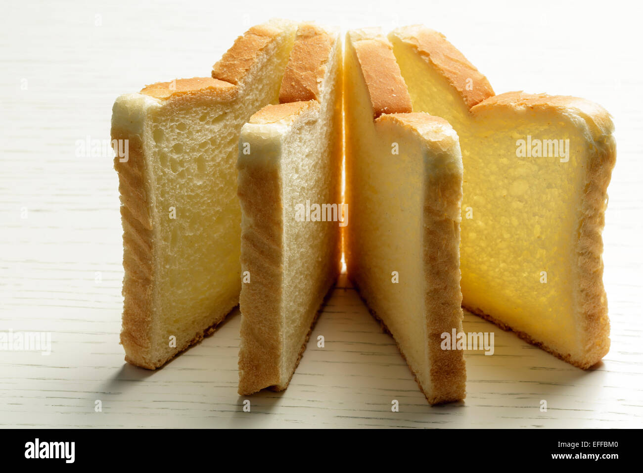 Sliced toast bread on a white surface Stock Photo - Alamy