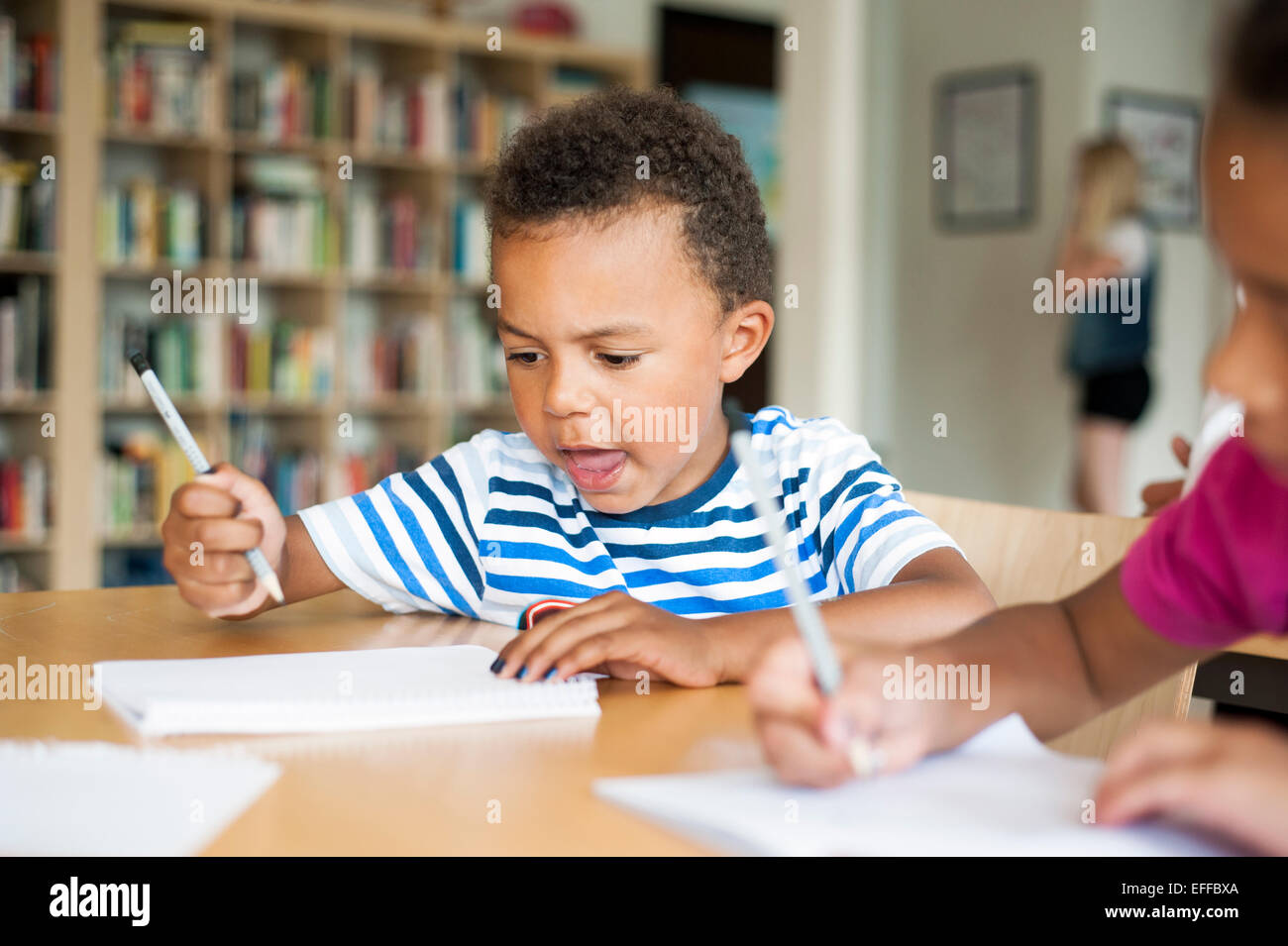 Cute boys classmates in classroom hi-res stock photography and images ...