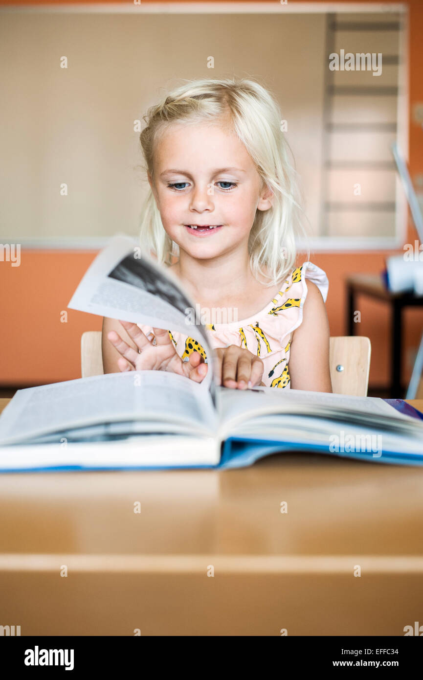 Turning page girl hi-res stock photography and images - Alamy