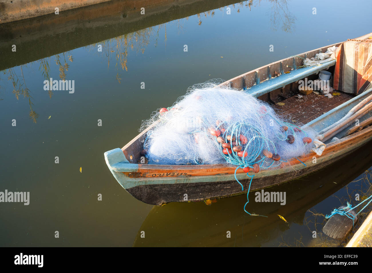 Old boat with fishing nets on its prow Stock Photo - Alamy