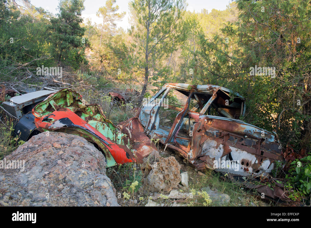 Dumping ground with metal barrels and other garbage Stock Photo - Alamy
