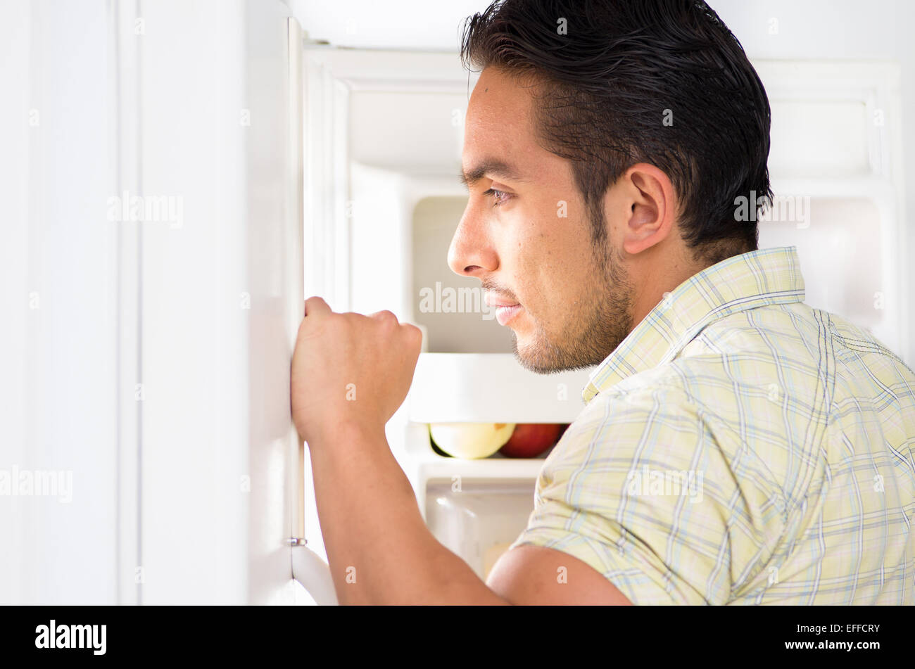 Man looking in fridge hi-res stock photography and images - Alamy