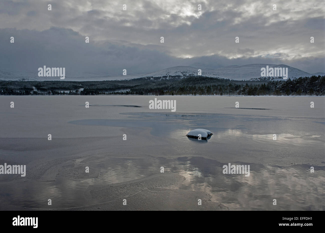 Snow Ice and still water pools on loch Morlich Inverness-shire. SCO ...