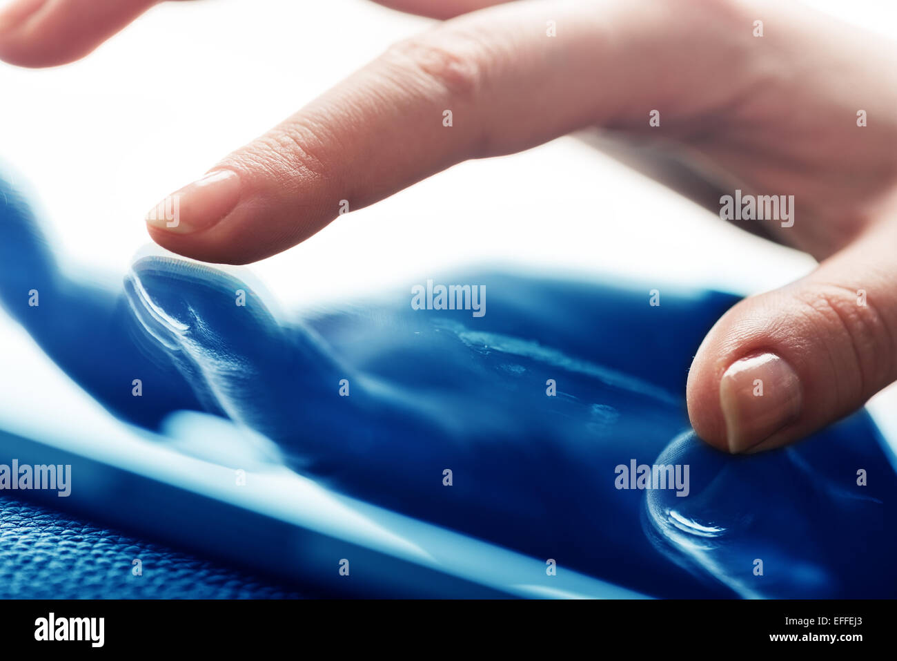 closeup of finger touching screen on tablet-pc Stock Photo - Alamy