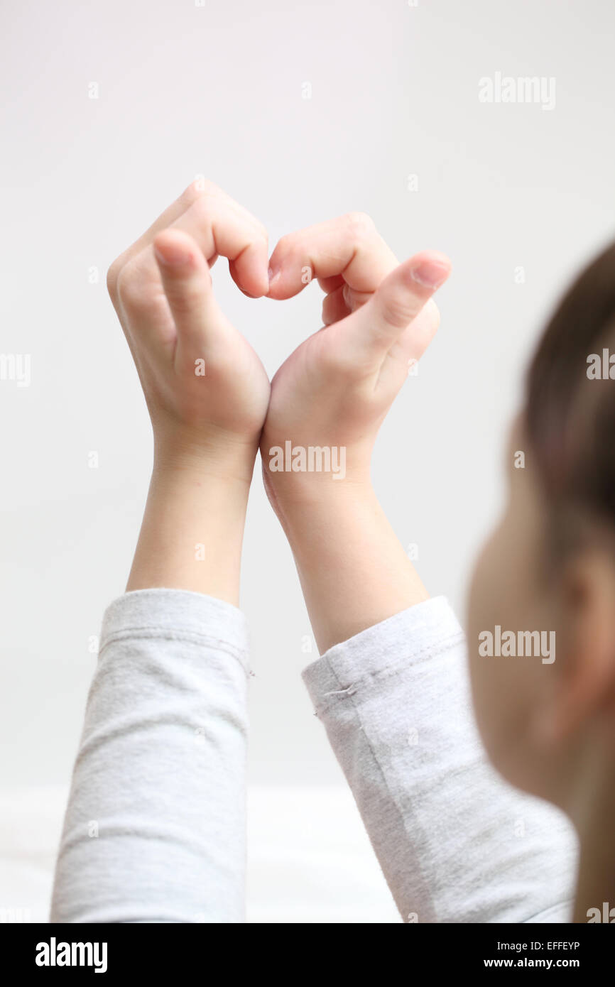 girl making a heart hands Stock Photo - Alamy