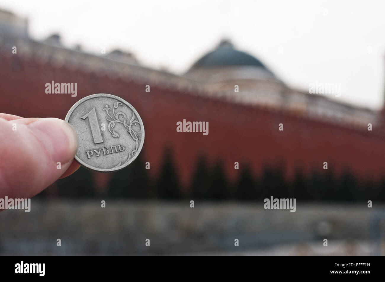 Russian ruble on the background of Kremlin wall on th Red Square in ...