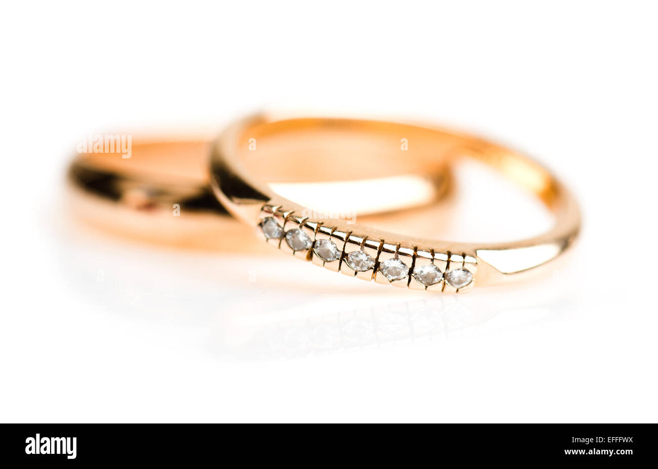 Gold wedding rings isolated on white background Stock Photo - Alamy