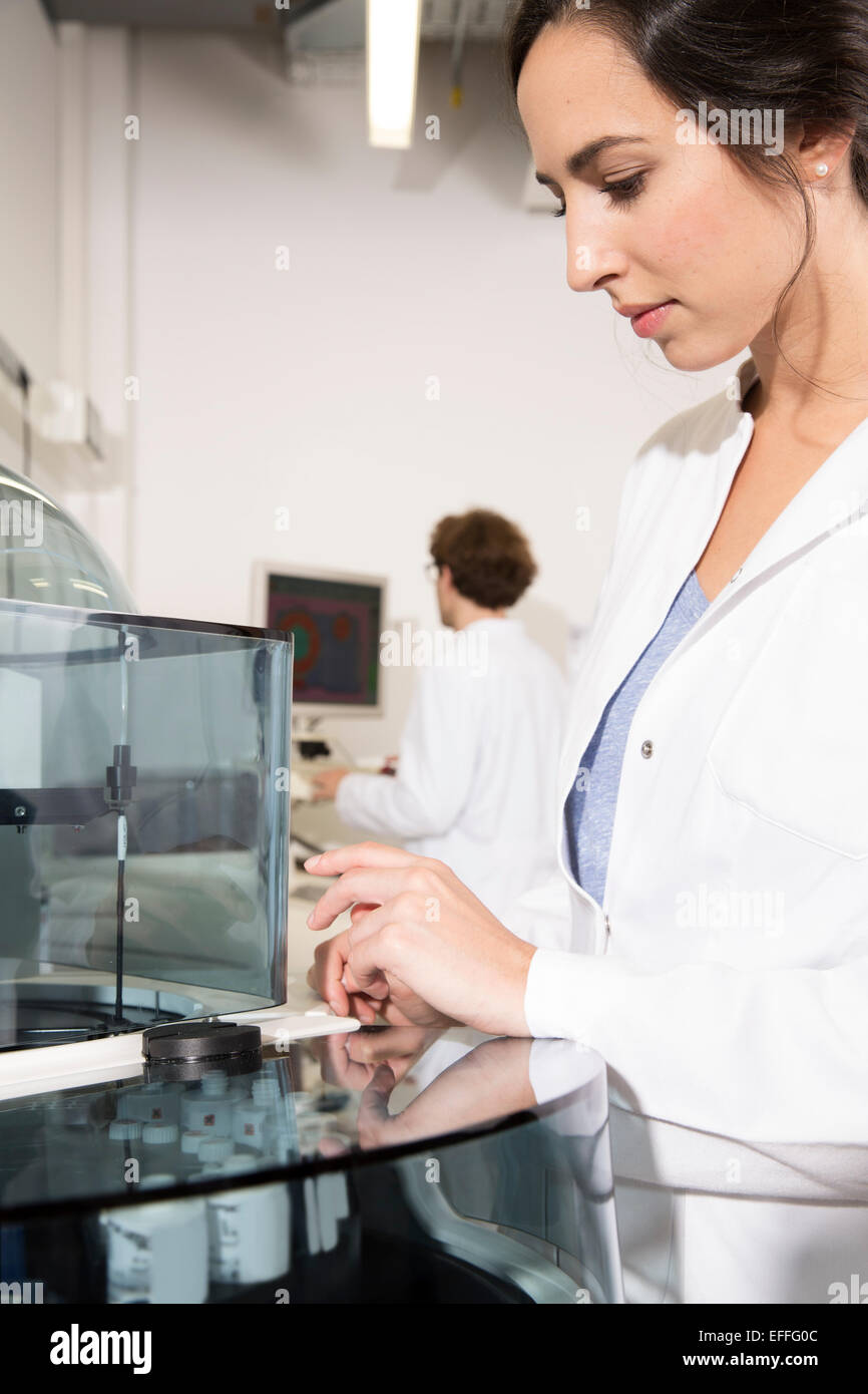 Scientists working in laboratory, Female scientist working on ...