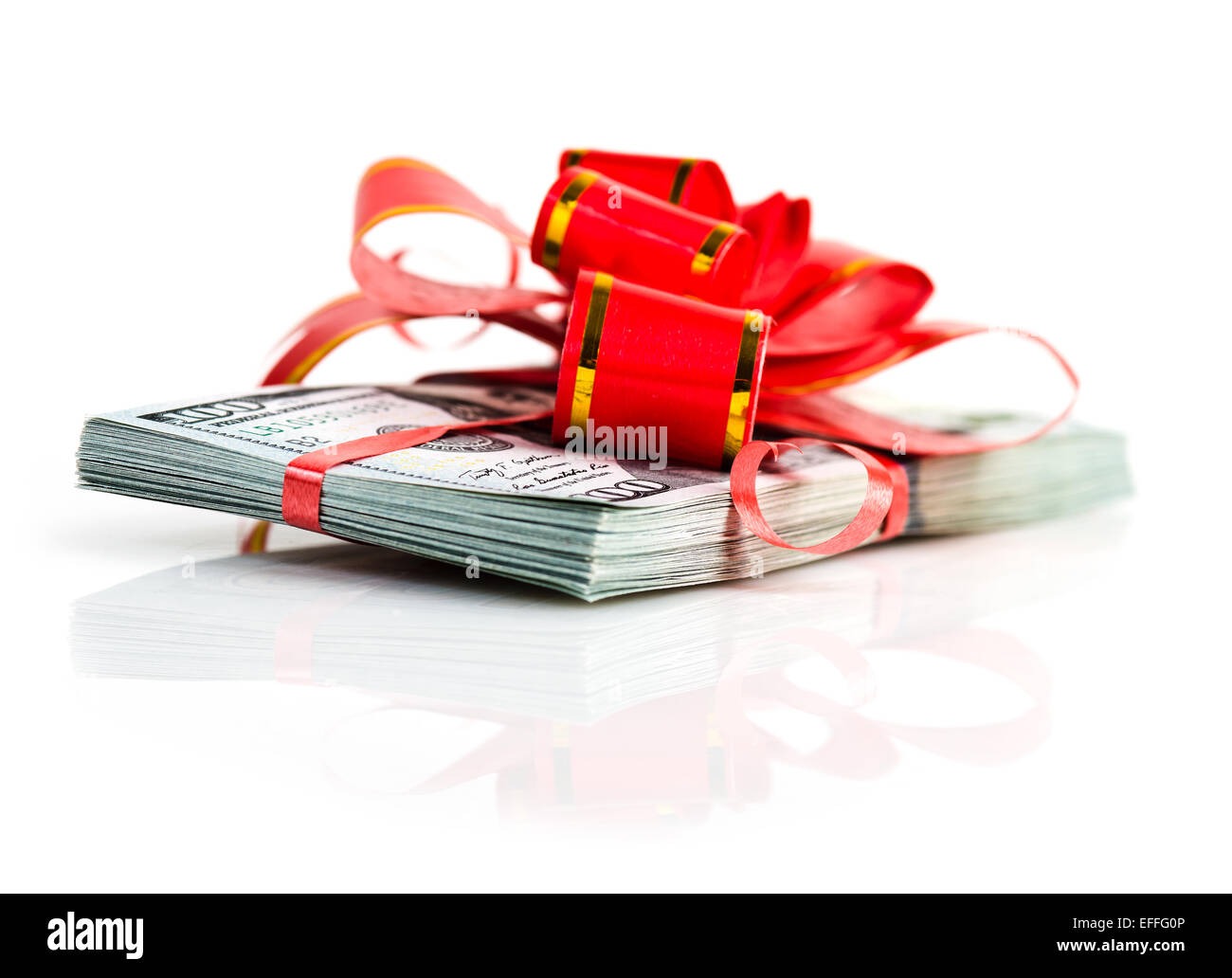 Money gift, big stack of dollars with red bow isolated on white ...