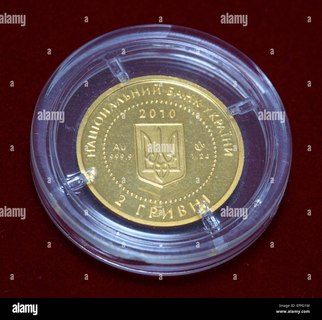 Gold coin in a glass box Stock Photo - Alamy