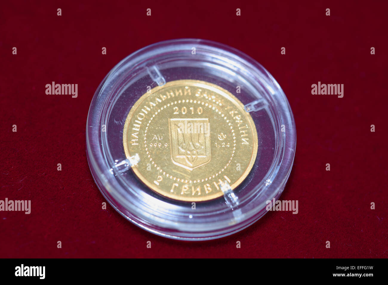 Gold coin in a glass box Stock Photo - Alamy