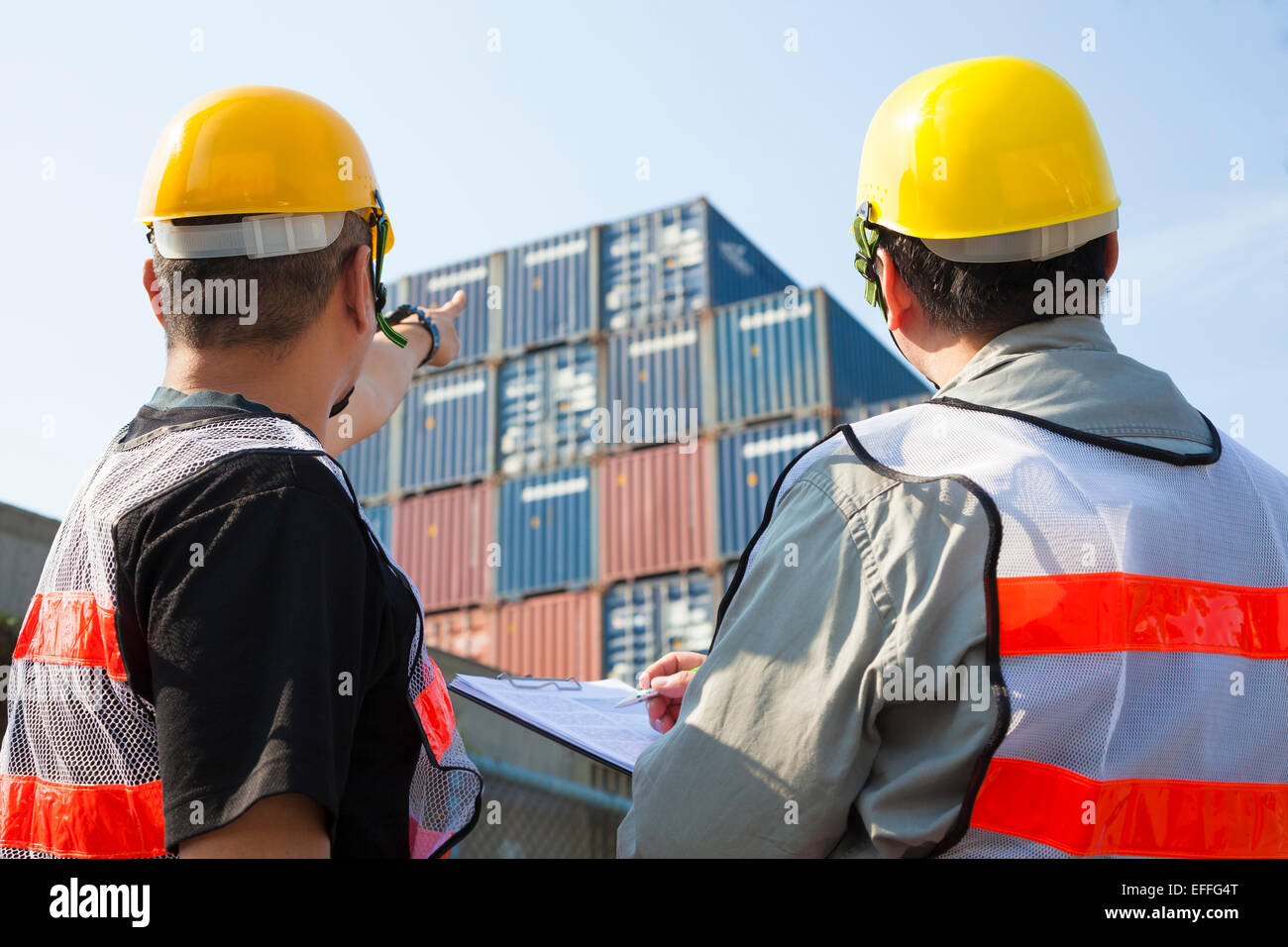 containers workers discussion and pointing for inspection Stock Photo ...
