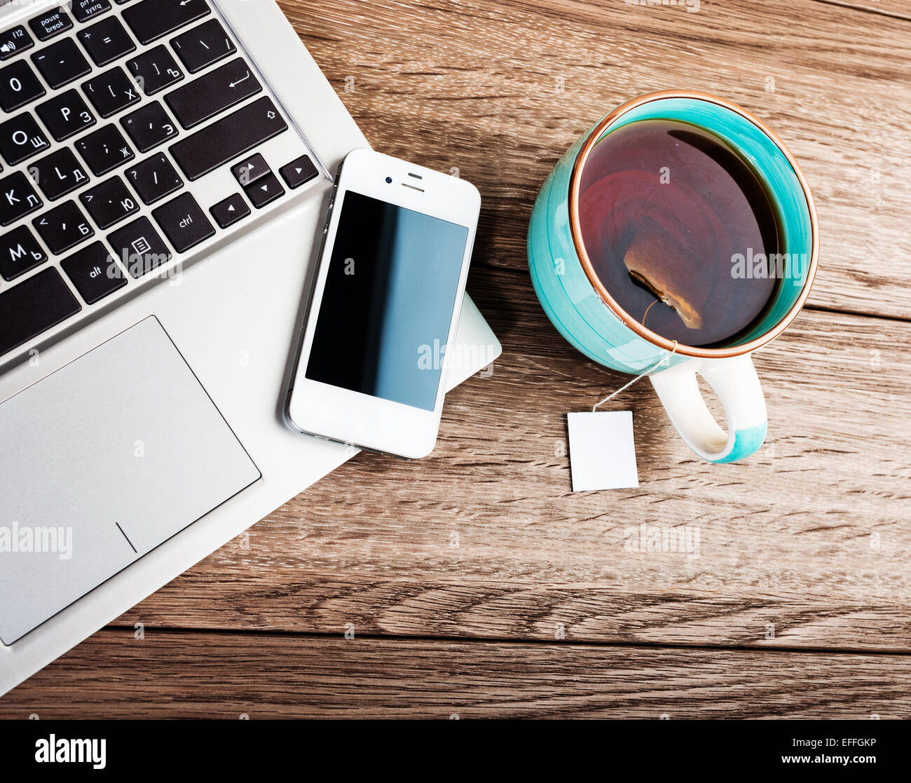 Office workplace with open laptop on wooden desk Stock Photo - Alamy