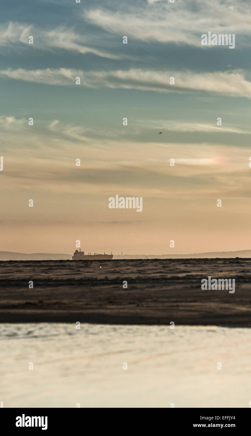 Spain, Andalusia, Tarifa, Freight ship in front of coast Stock Photo ...