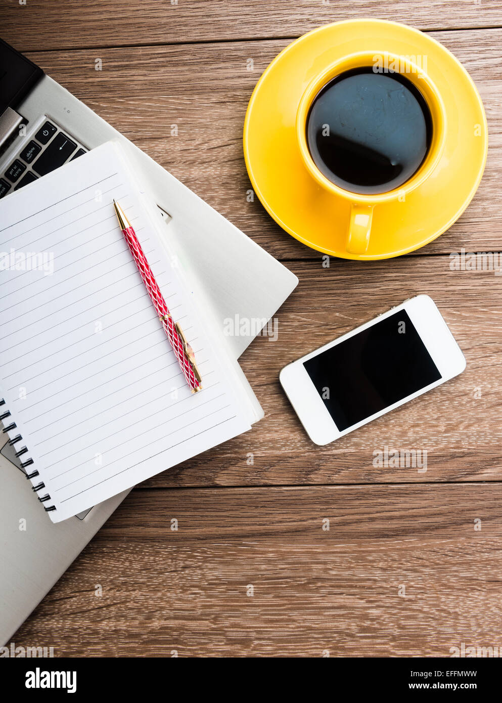 Office desk with laptop computer, notebook, mobile smartphone and ...