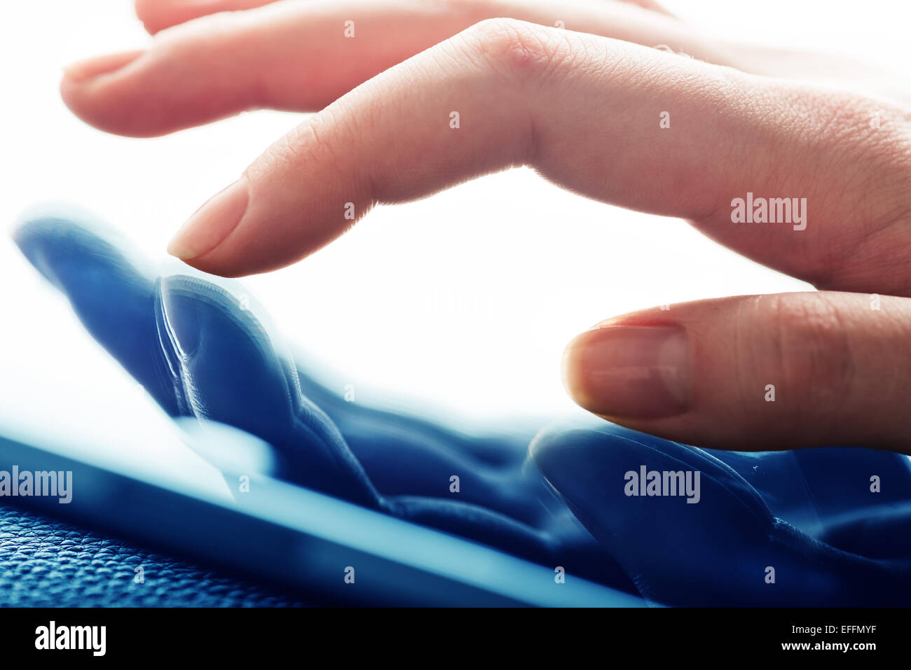 closeup of finger touching screen on tablet-pc Stock Photo - Alamy