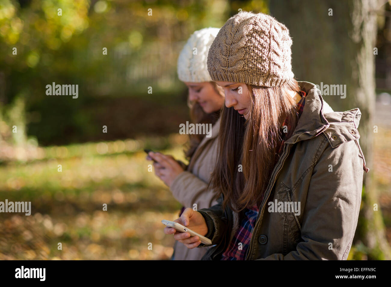 Germany, Rhineland-Palatinate, Female students using smart phone ...