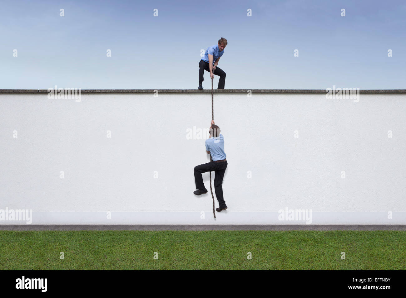 Man Climbing Over Wall Stock Photos & Man Climbing Over Wall Stock ...