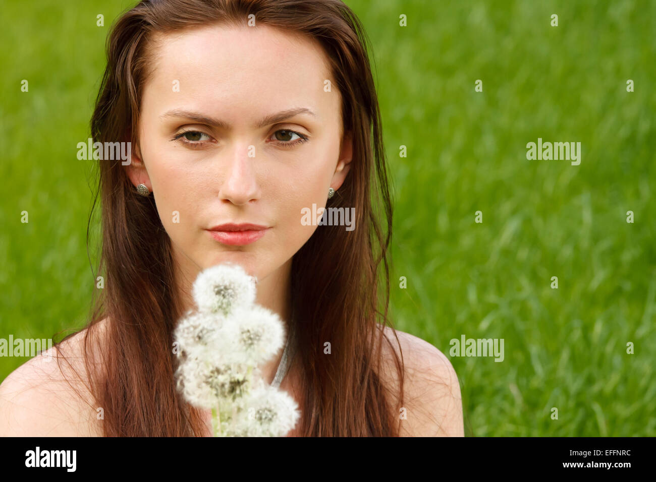 Lady blowing dandelions hi-res stock photography and images - Alamy