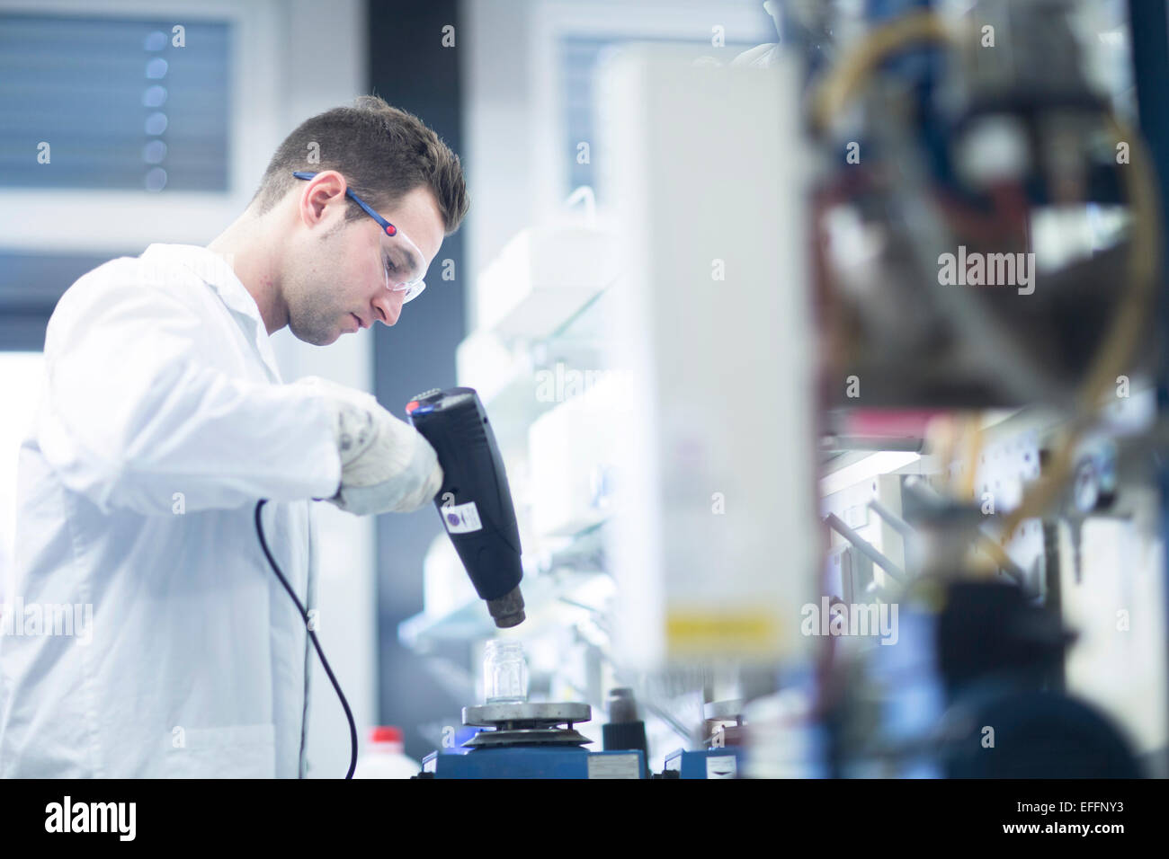 Chemist working in lab drying a sample Stock Photo - Alamy