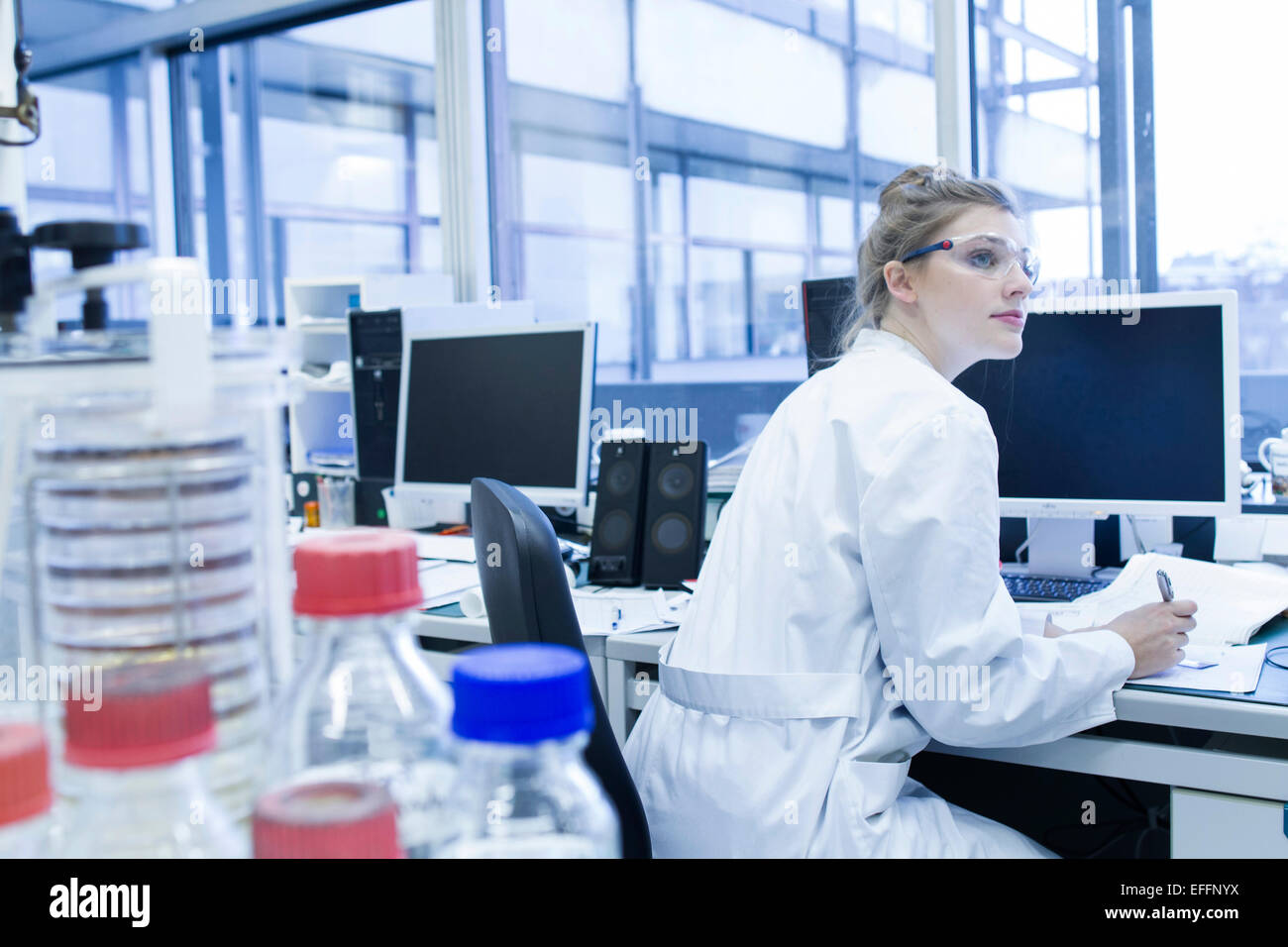 Biologist working in laboratory at desk Stock Photo - Alamy