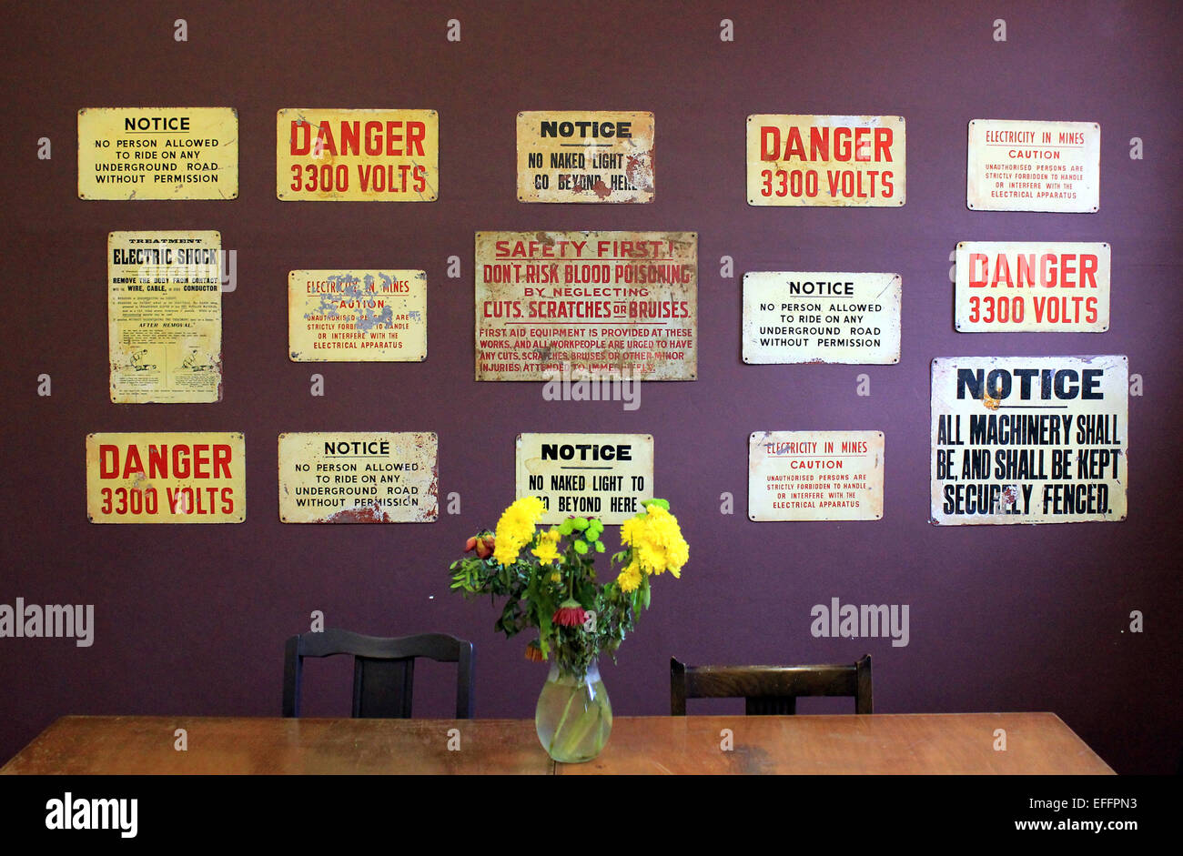 A display of safety notices and a vase of flowers, a poignant reminder ...