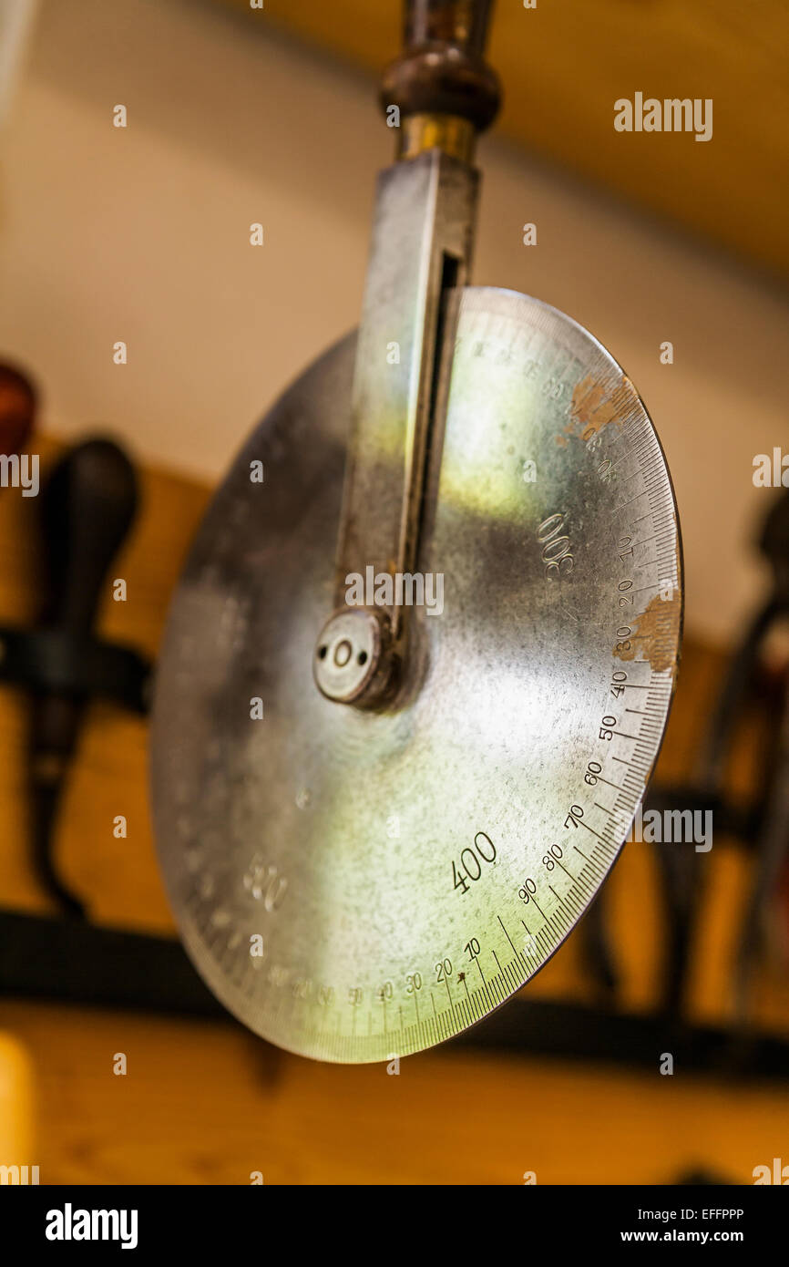 Vintage measuring wheel in saddlery Stock Photo - Alamy