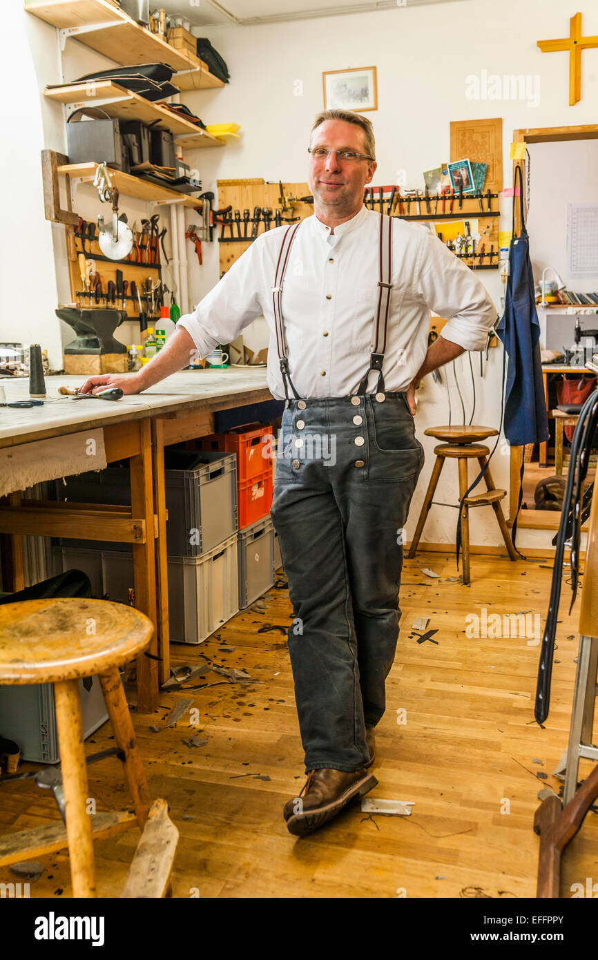 Saddler standing in his workshop Stock Photo - Alamy