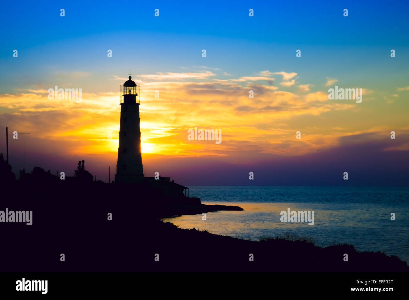 Lighthouse on sunset Stock Photo - Alamy