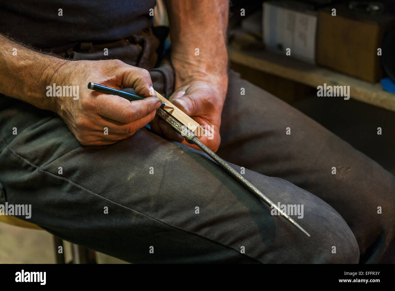 Knife maker drawing marking on knife handle Stock Photo - Alamy