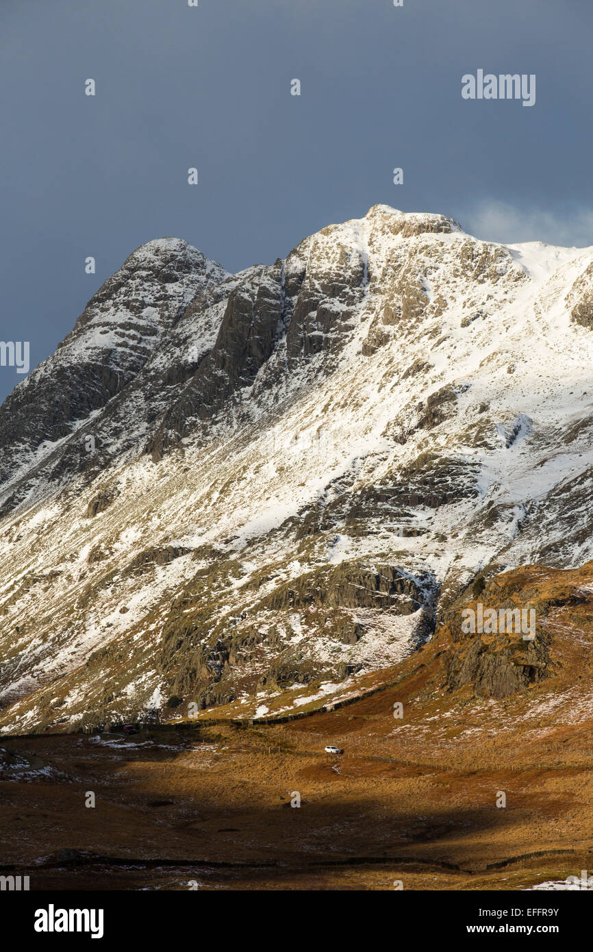 The Langdale Pikes from Blea Tarn in the Lake District, UK, with a car ...