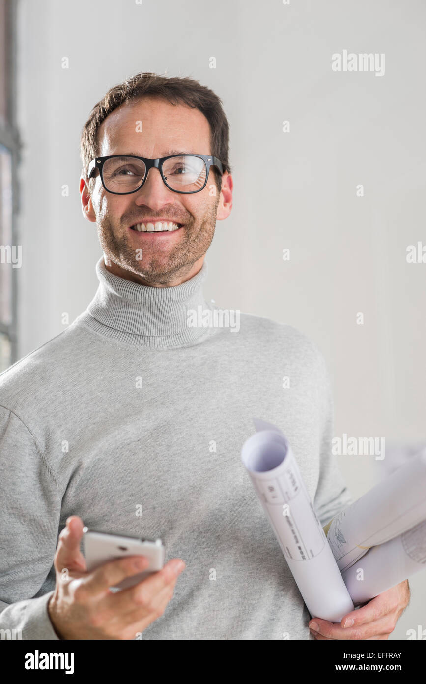 Smiling architect in office Stock Photo - Alamy