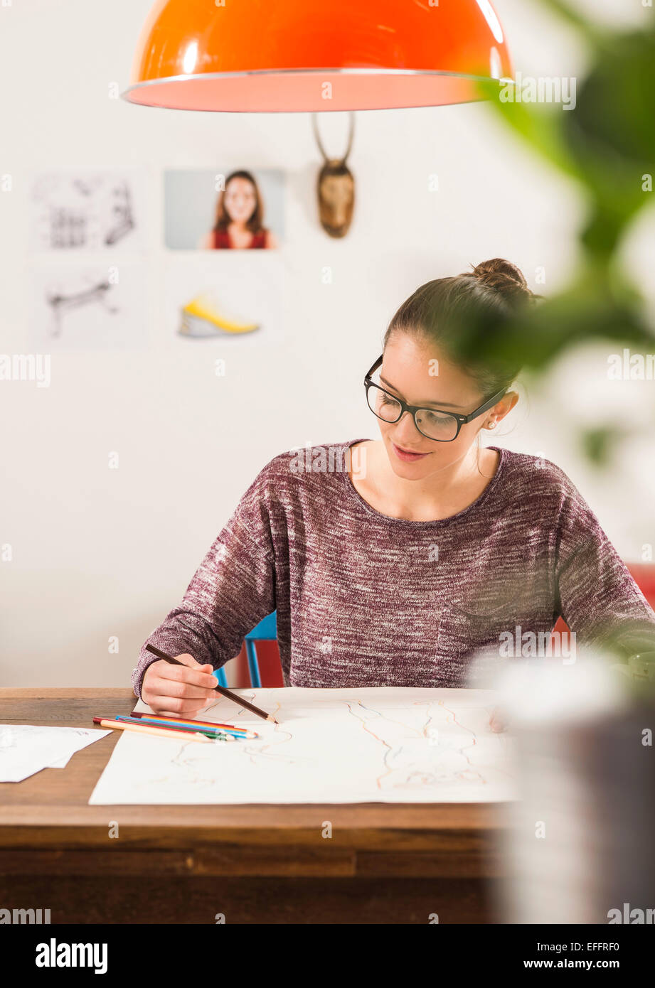 Young woman drawing at home Stock Photo - Alamy