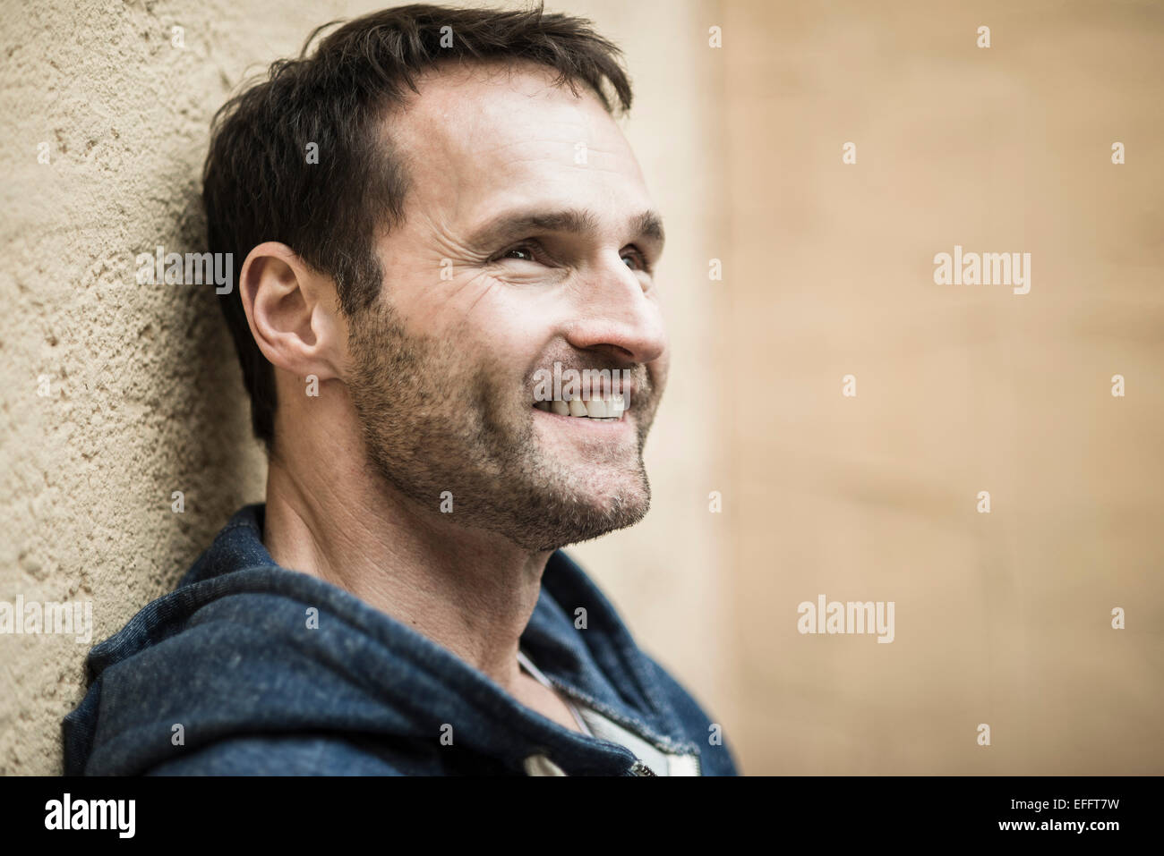 Portrait of smiling man with stubble Stock Photo - Alamy
