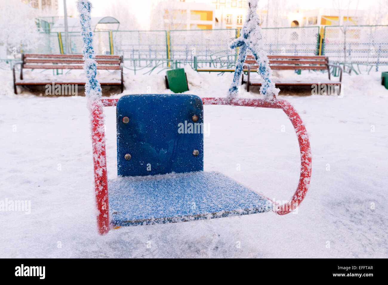 Empty children playground in the snow hi-res stock photography and ...