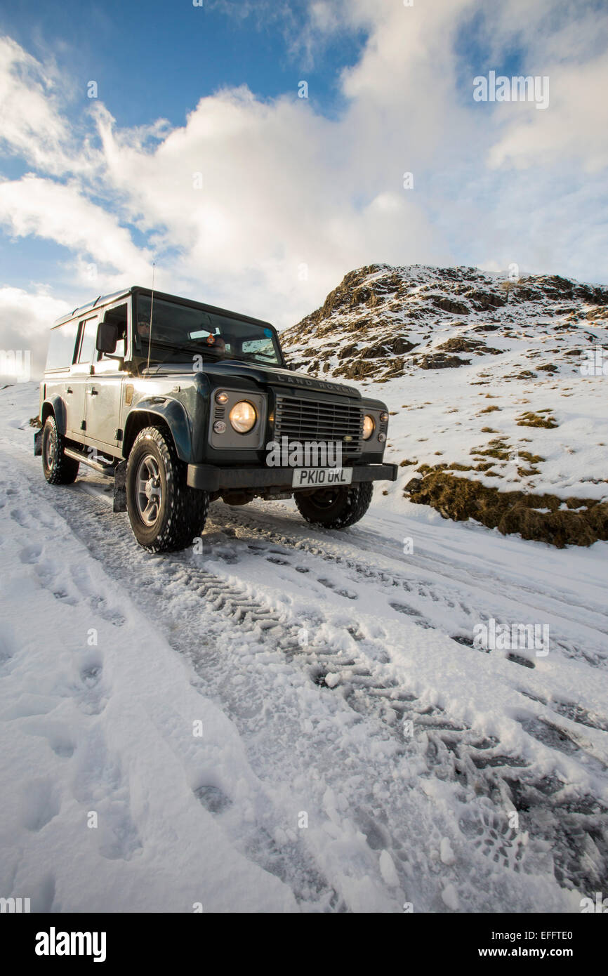 A Land Rover descending Wrynose Pass in winter conditions, Lake ...