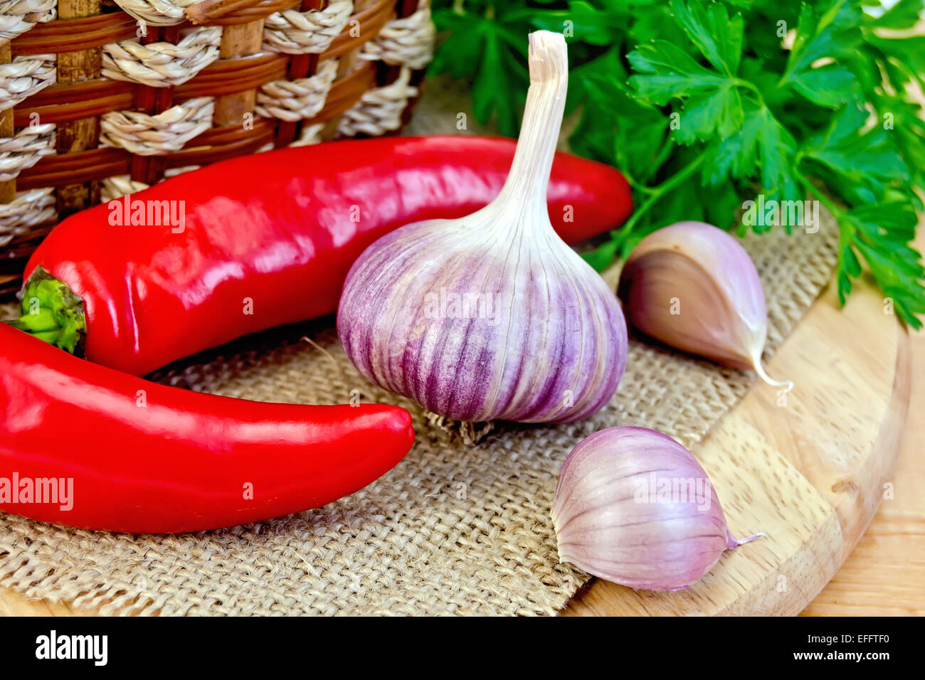 Garlic with spicy red pepper on board Stock Photo - Alamy
