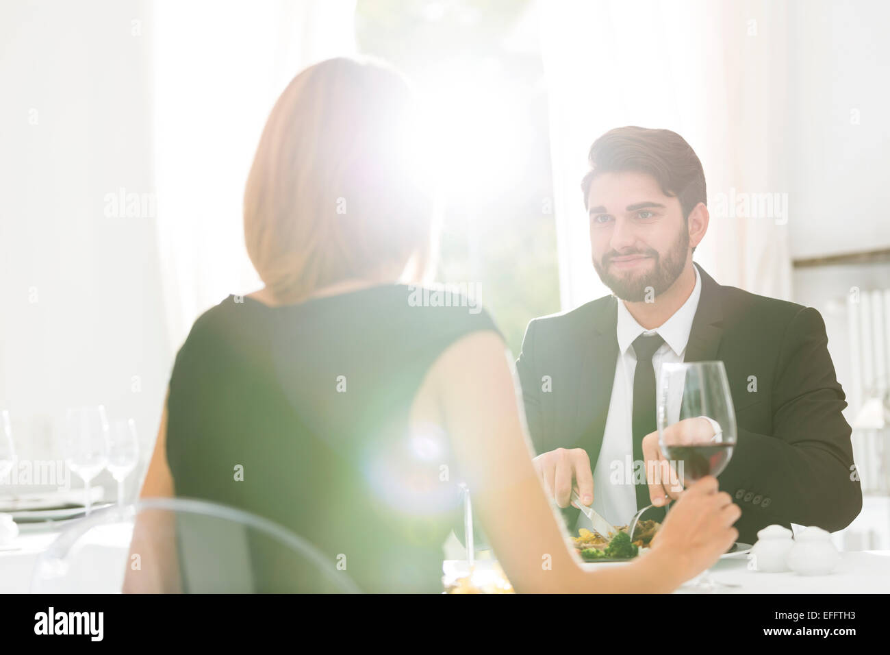 Elegant couple having dinner in restaurant Stock Photo - Alamy