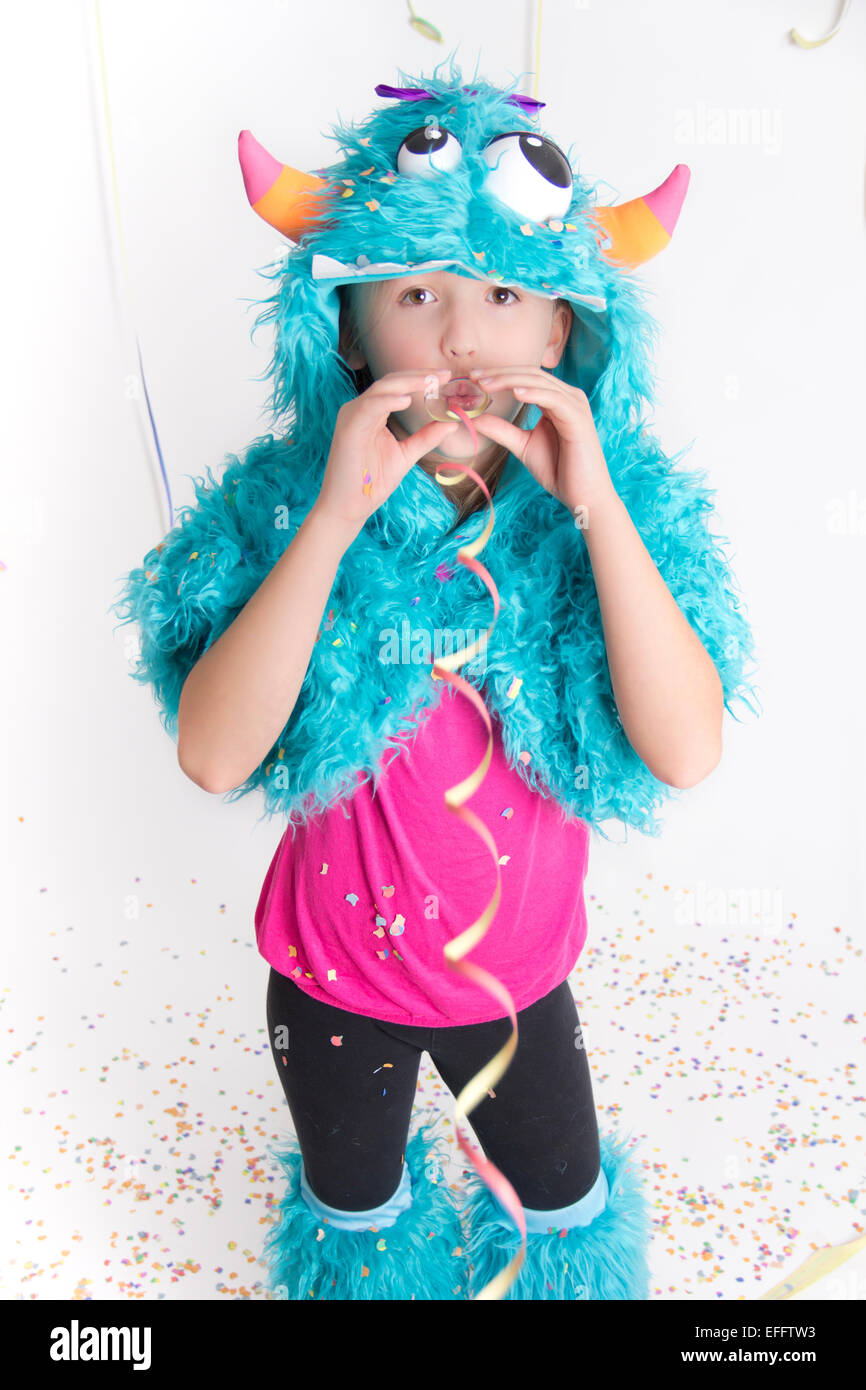 Girl masquerade as a monster standing in front of white background ...