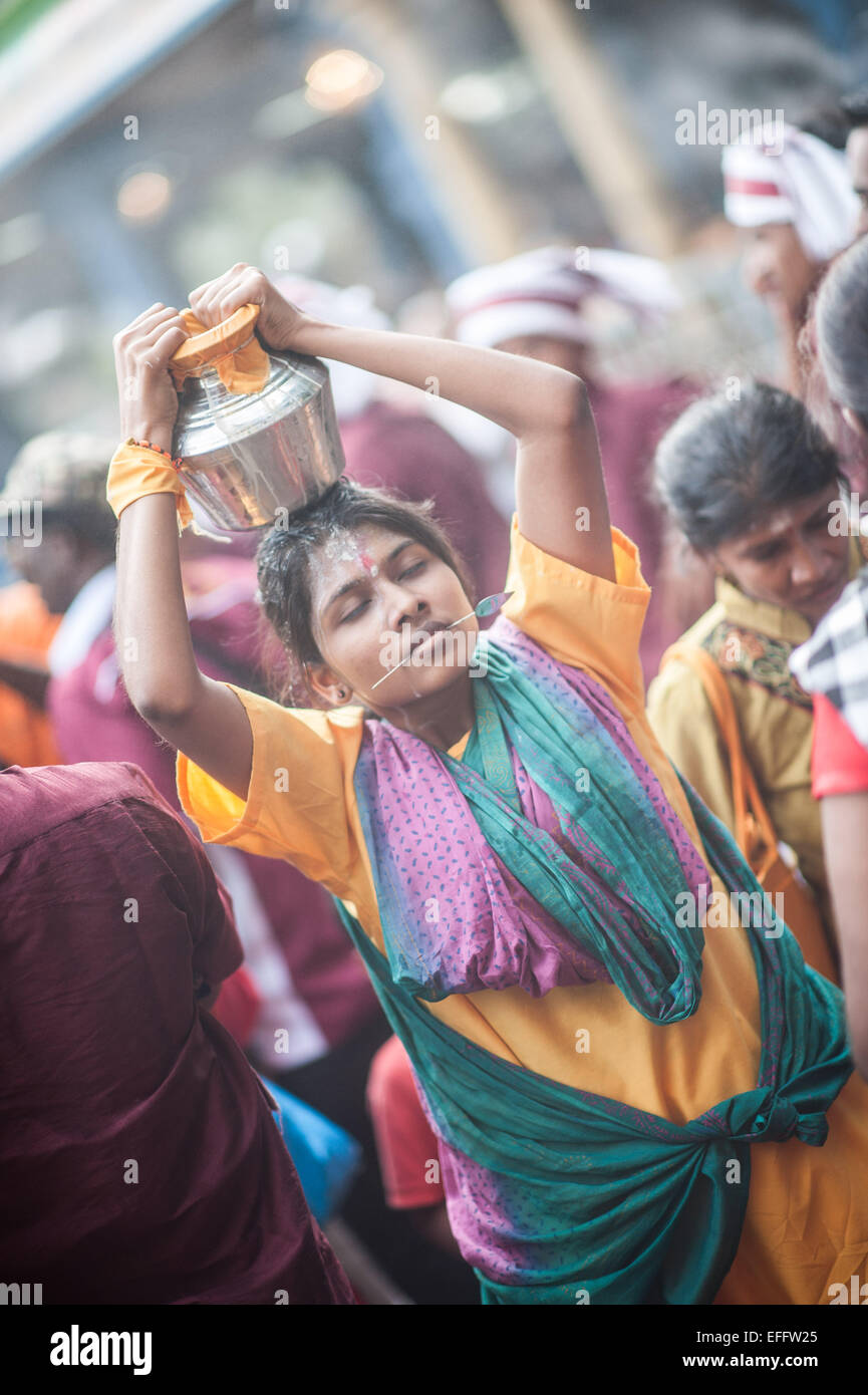Female Hindu devotee carrying Kavadi during Thaipusam 2015 at Batu ...