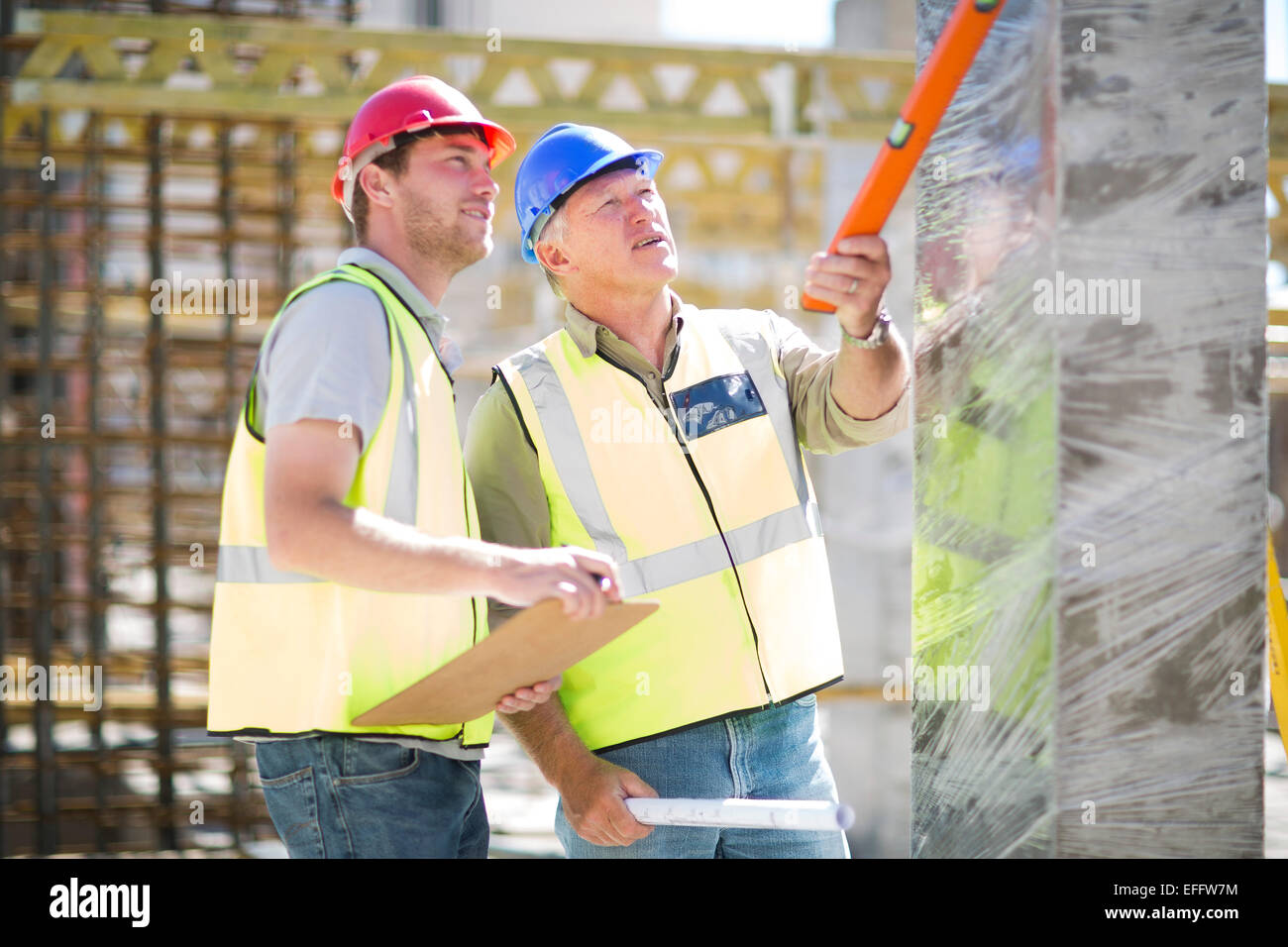 Two construction workers in construction site Stock Photo - Alamy
