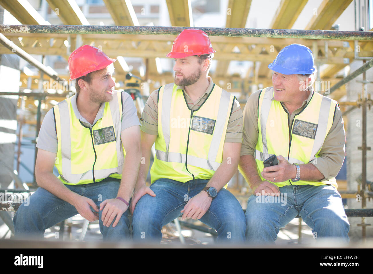 Construction workers having a break Stock Photo - Alamy