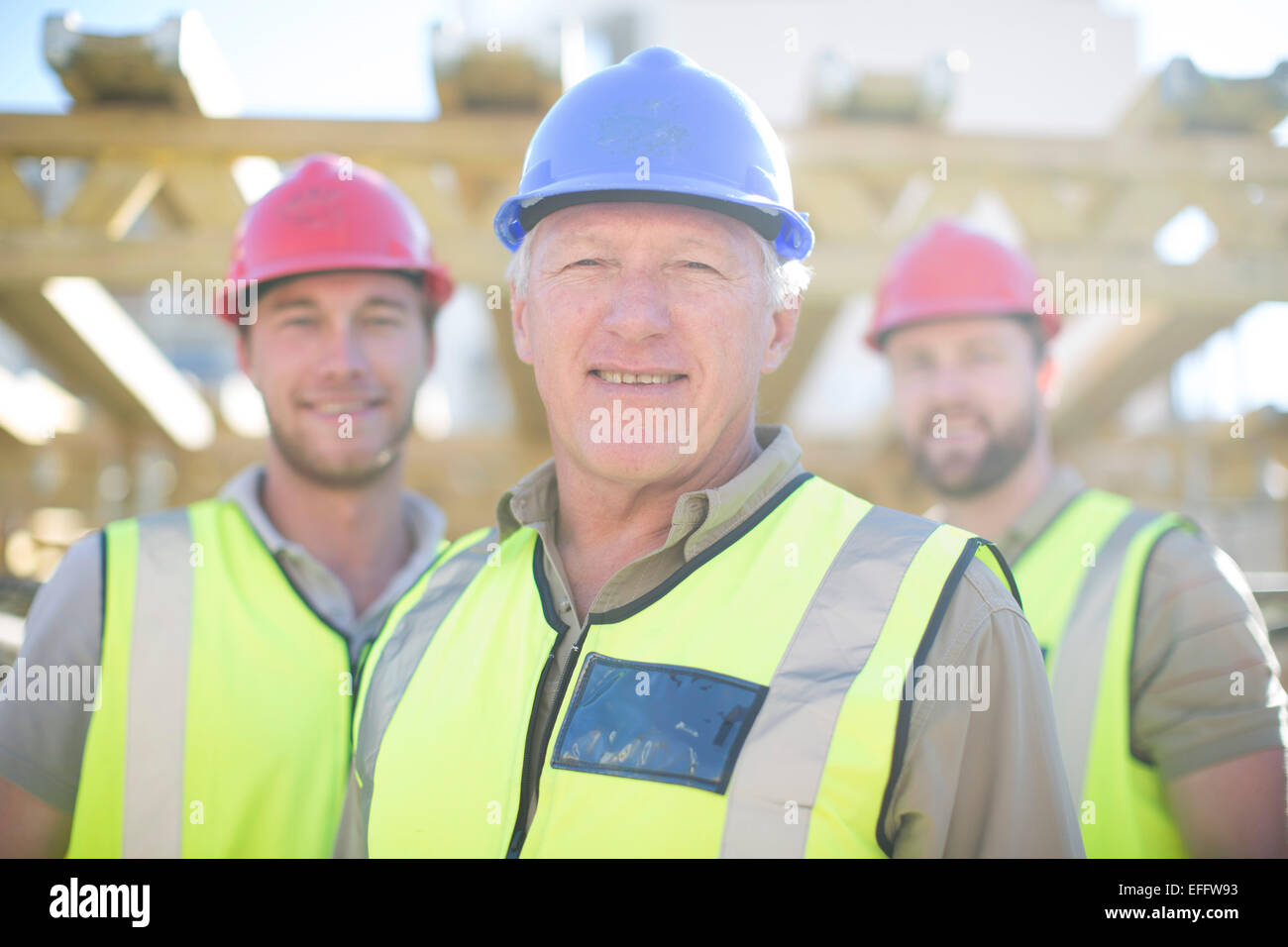 Portrait of confident construction workers in construction site Stock ...