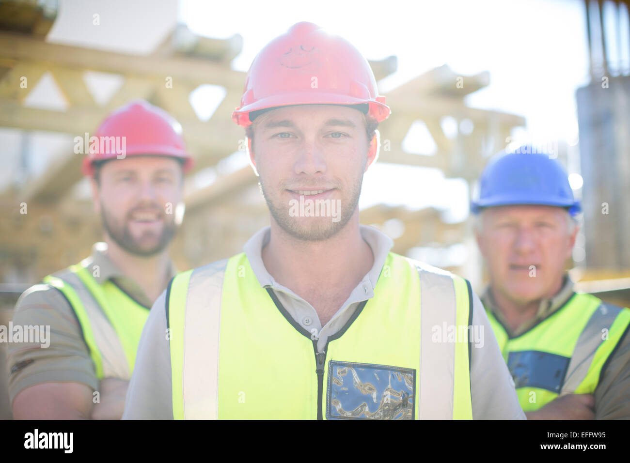 Portrait of confident construction workers in construction site Stock ...