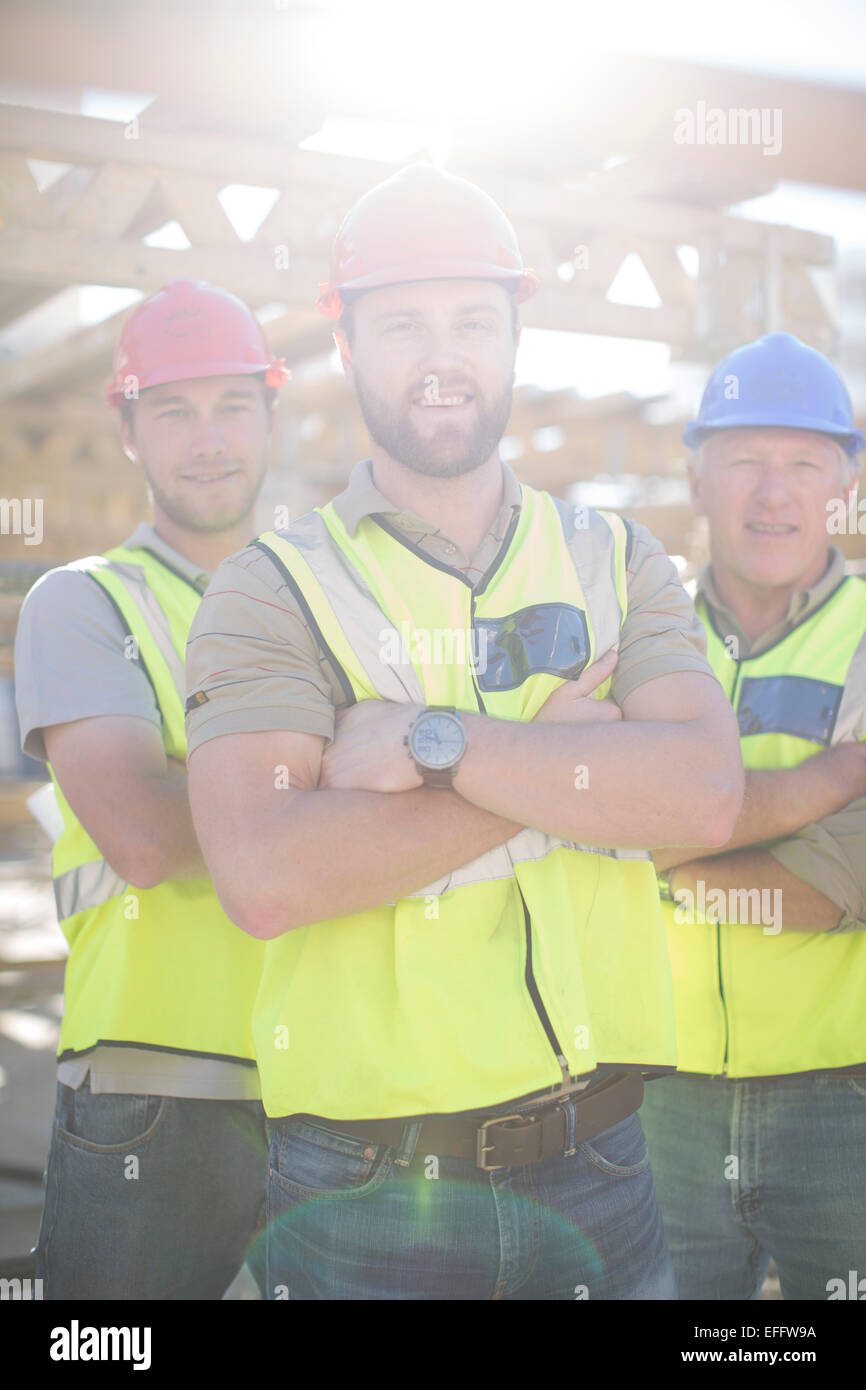 Portrait of confident construction workers in construction site Stock ...