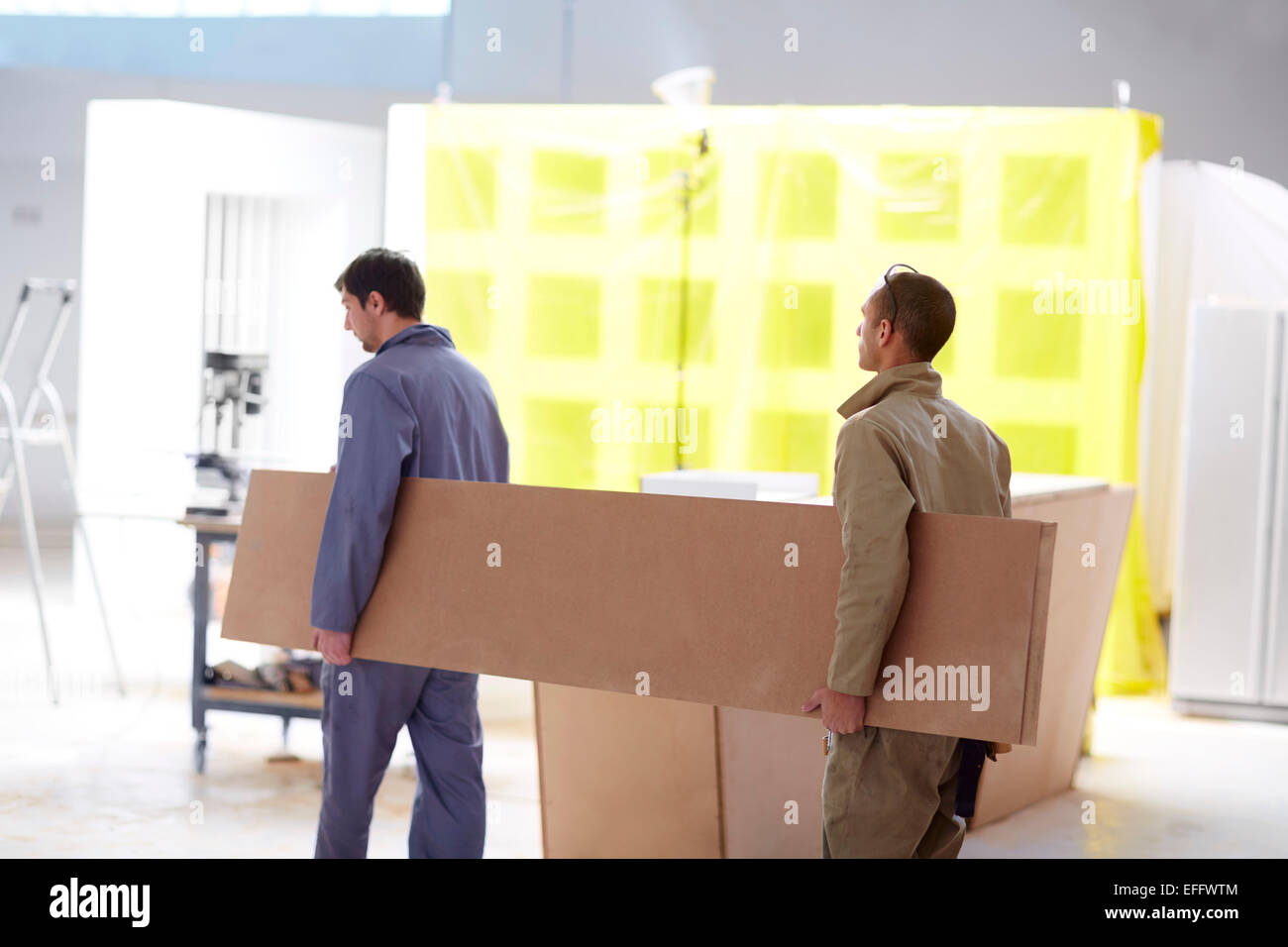 Woodwork, Carpenters carrying planks Stock Photo - Alamy